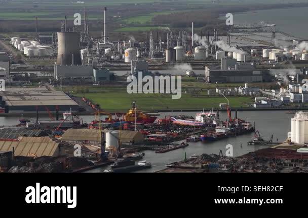 Large industrial port with an oil refinery and petrochemical plant ...