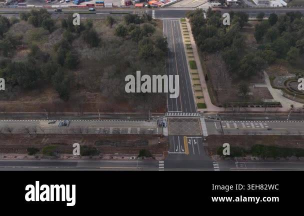 High angle aerial view over a busy commercial port and adjacent road ...