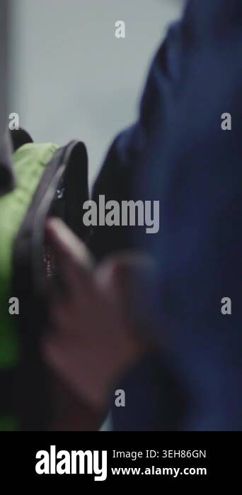 masked woman inspecting insulated delivery bag, closeup hands unzipping ...