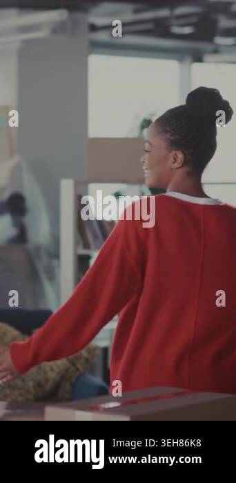 black couple celebrating sold sign in living room, joyful black woman ...