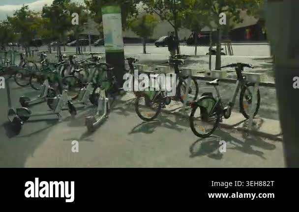 15 may 2026, Lisbon, Portugal - People are seen near a bike sharing ...