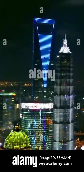 Discover the bright city lights of Shanghai at night from an aerial ...
