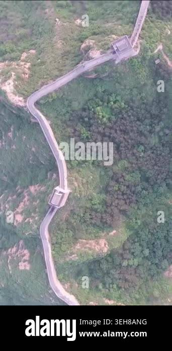 Drones capture the Great Wall of China winding through lush green ...