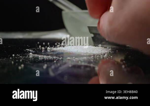 Addictive person crushing prescription opioid drug of fentanyl to ...