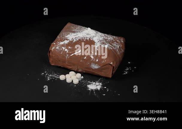 Concept of brown packages filled with drugs and wrapped in duct tape to ...