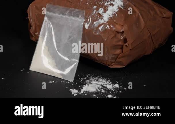 Concept of Drug brick package delivered and cut with knife for sample ...
