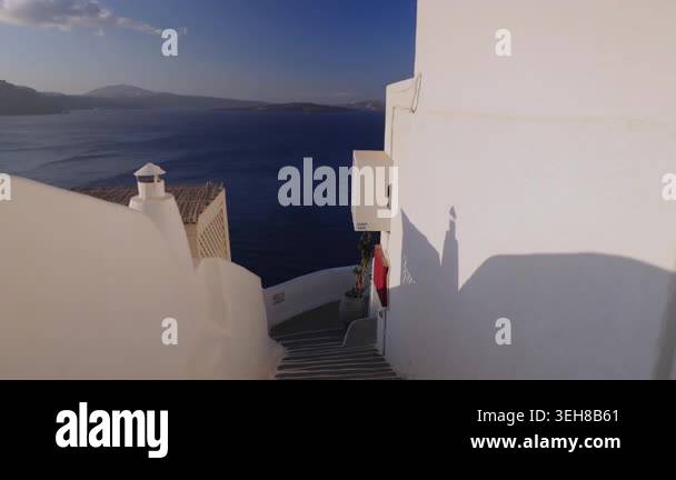 Picturesque whitewashed stairway winds down through traditional ...