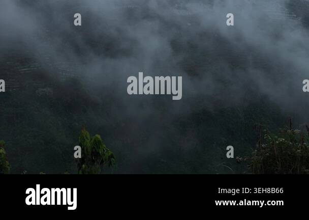 Moody Fog Rolling Over Dark Green Mountain Terraced Hills Stock Video ...