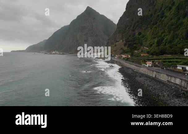 Aerial view of Madeira north coast with ocean shoreline, mountain ...
