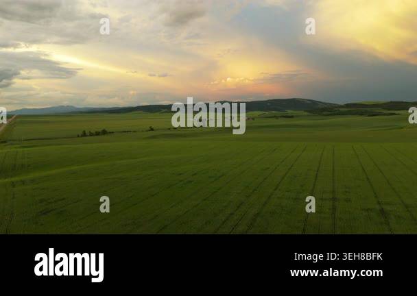 Aerial drone footage captures breathtaking golden hour sunset over vast ...