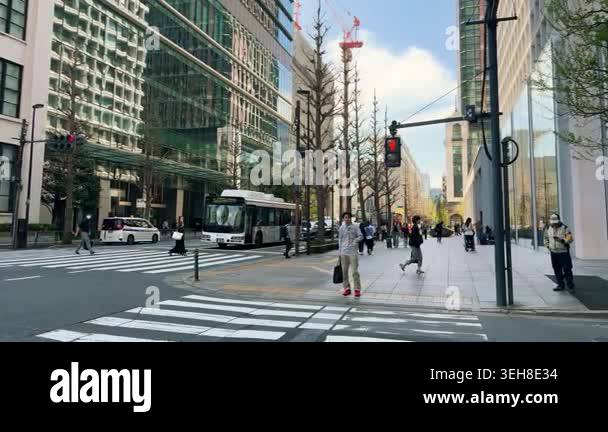 TOKYO, JAPAN - APRIL 06, 2026: Tokyo street view with a city bus ...
