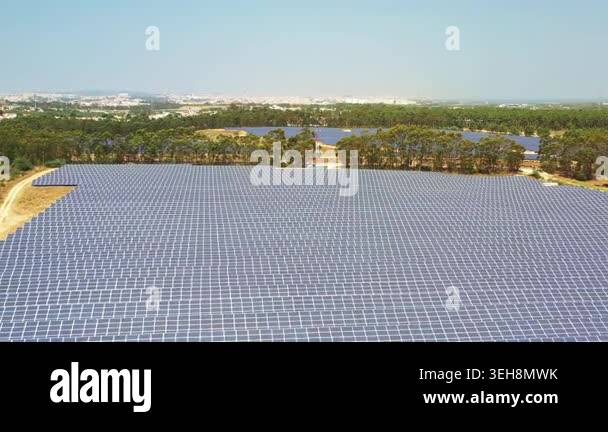 Aerial drone view of solar farm with rows of photovoltaic panels ...