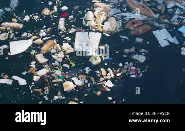 The river shows trash and debris floating on the water surface Stock ...
