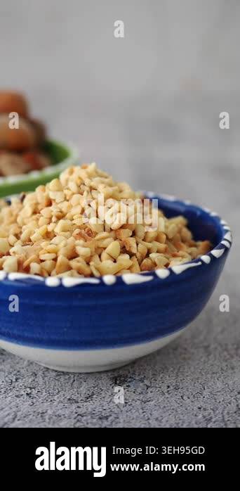 Chopped hazelnut in Blue Bowl, Hazelnuts in Background Stock Video ...