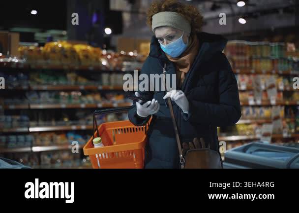 Senior caucasian woman reads the composition of food so as not to cause ...