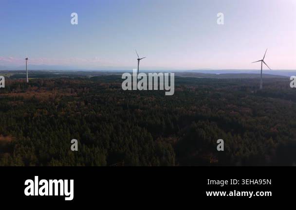 Wide shot of wind farm with four wind turbines near Starnberg, Germany ...