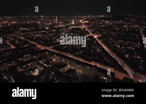 Drone night view of Munich Germany shows Frauenkirche Neues Rathaus ...