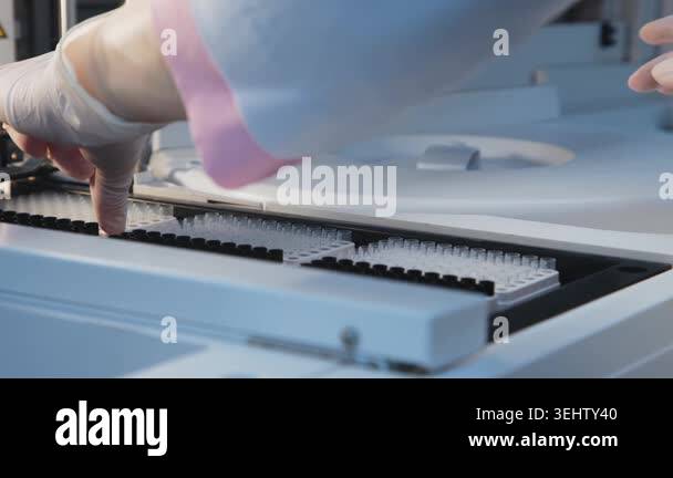 Person using laboratory equipment for testing in a clean and sterile ...