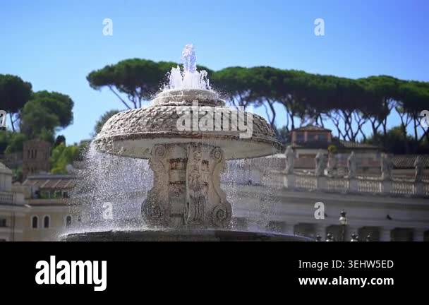 Historic Stone Fountain with Splashing Water and Mediterranean Pine ...