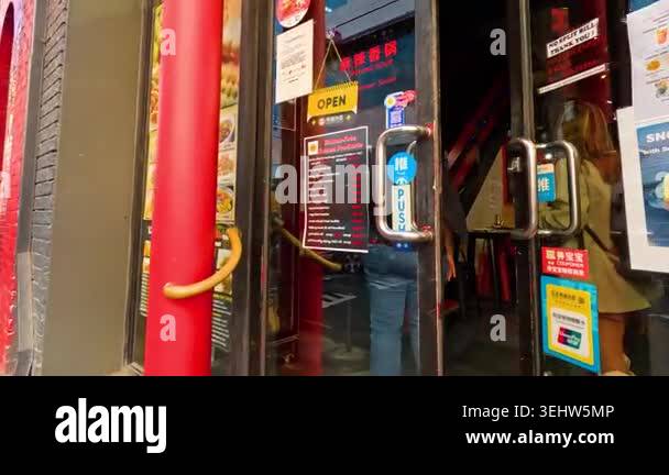 Open restaurant door with menu and sign in a bright urban setting Stock ...