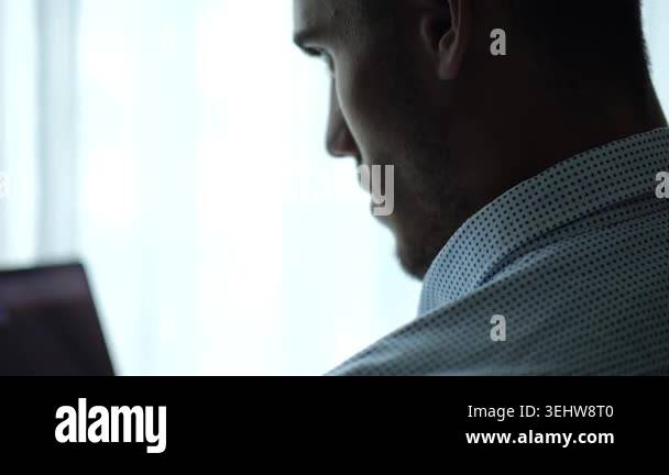 Close up portrait of young entrepreneur standing near large window in ...