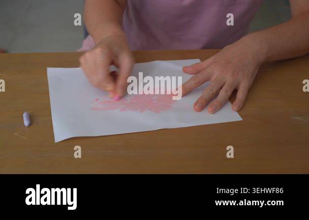Close up woman drawing on paper with colored chalk with clear sound ...