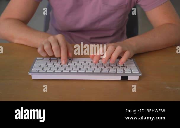 Close up woman typing on wireless keyboard on table with clear sound ...