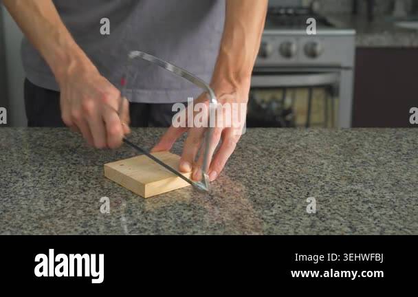 Close up man cutting wood with jigsaw saw with clear sound. Hands ...