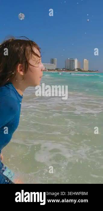 10 year old boy having fun on a Caribbean sea beach. Happy child ...