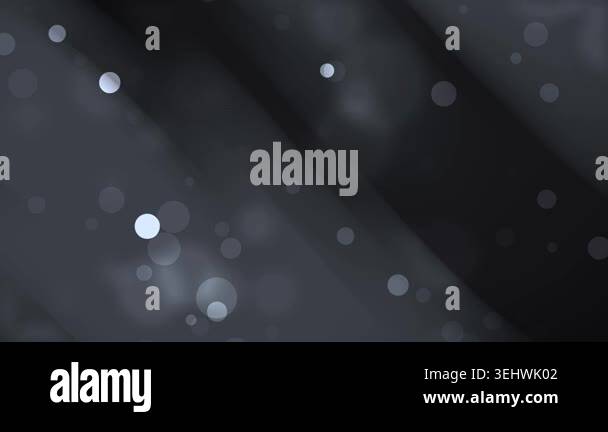 Abstract black background with soft bokeh lights creating a blurred ...