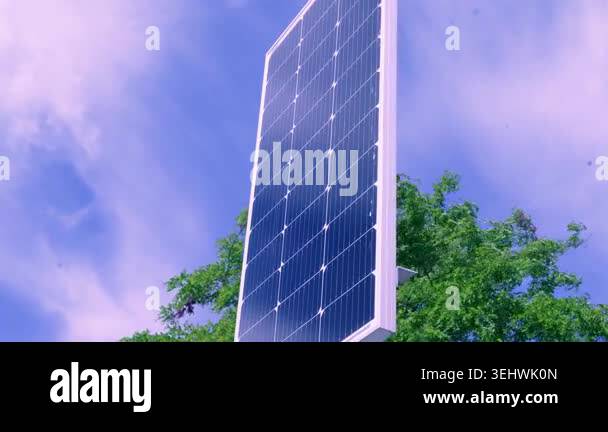 Low angle view of a single photovoltaic solar panel absorbing sunlight ...