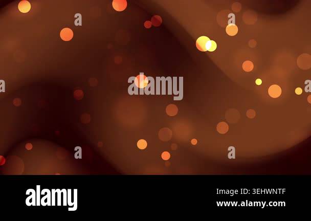 Abstract warm bokeh background with golden and orange circular light ...