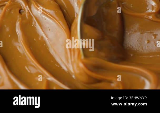 Space for text on boiled condensed milk texture or dulce de leche ...