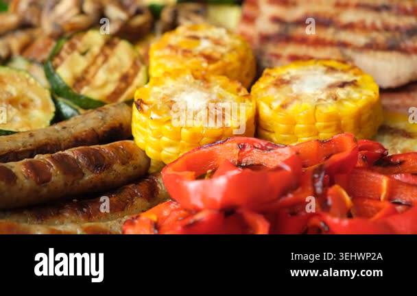 Assorted grilled meat, sausages and vegetables background Stock Video ...