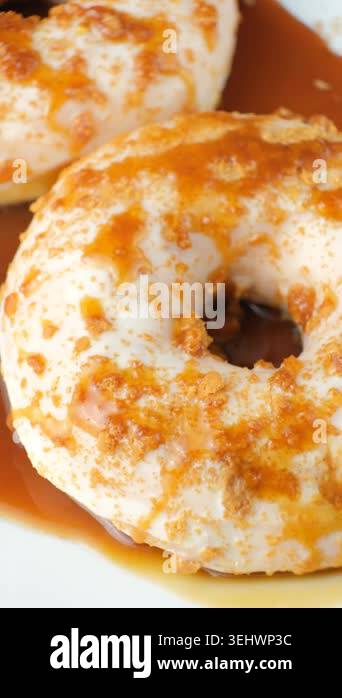 Sweet Donuts with Caramel Sauce Close-Up Vertical Rotation Stock Video ...