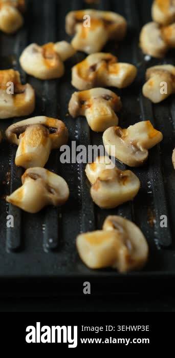 Roasted Champignon Mushroom Halves Close-up on Electric Grill Stock ...