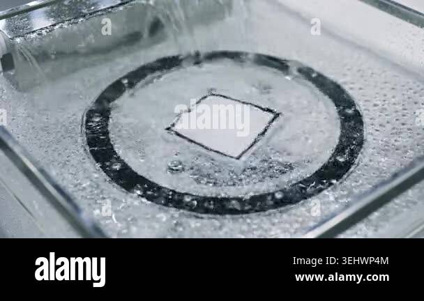 Close up of microchip undergoing advanced waterproof durability testing ...