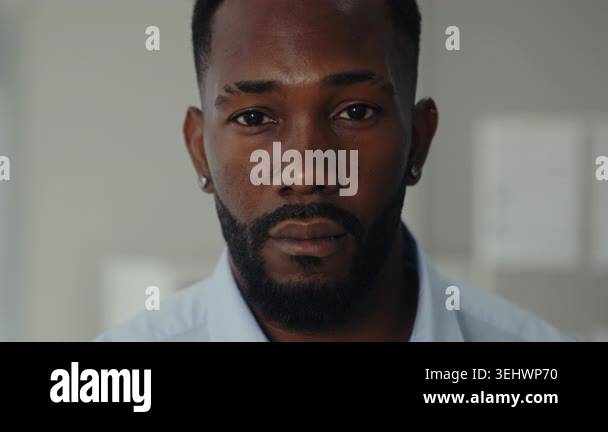 Portrait of serious African American businessman in casual attire ...