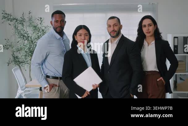 Portrait of confident multiethnic business team meets in corporate ...