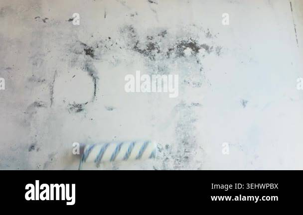 Person priming interior wall with roller in living room Stock Video ...