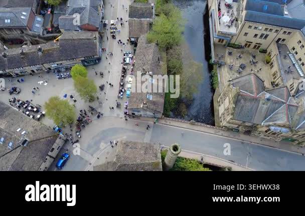 Aerial view of a quaint village with winding streets and a river ...