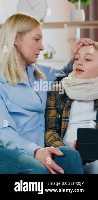 Healthcare and childcare concept where likable little bit ill teen boy ...