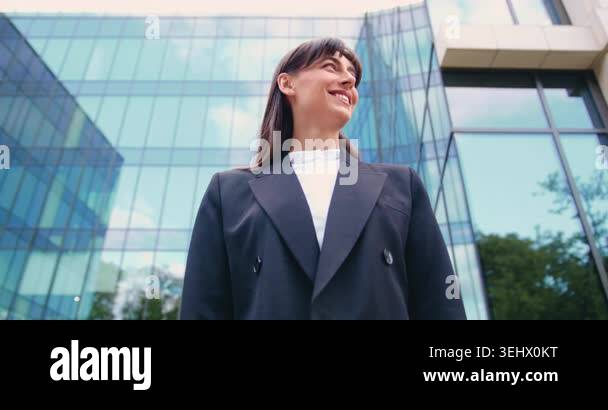 Portrait of a confident Caucasian businesswoman with dark hair in a ...