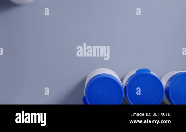 Close-up of a large group of white plastic bottles lined up in a ...