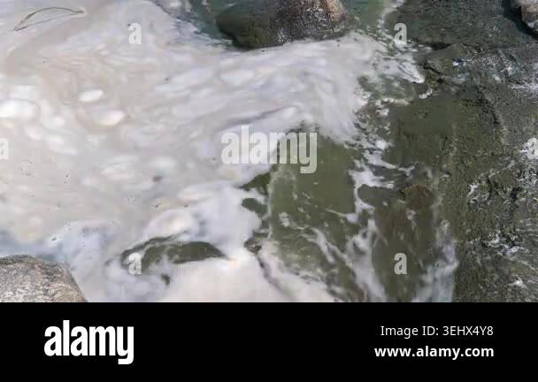 Polluted, foamy water in a lake Stock Video Footage - Alamy