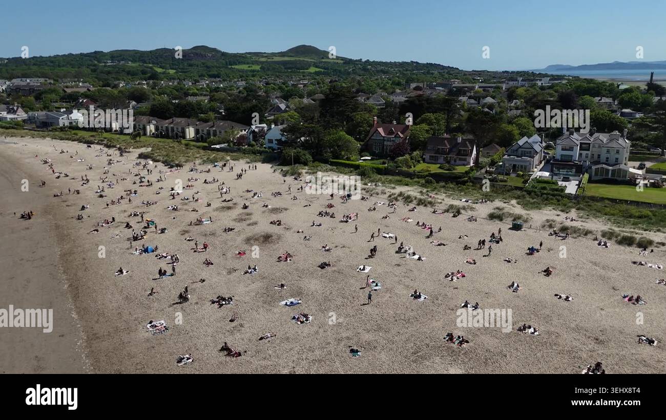 Sunbathers soak up the heat at Burrow Beach in Dublin Stock Video ...