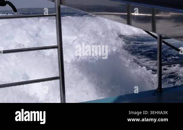 Close-up view of splashing waves as a motorboat moves. Scenic view from ...