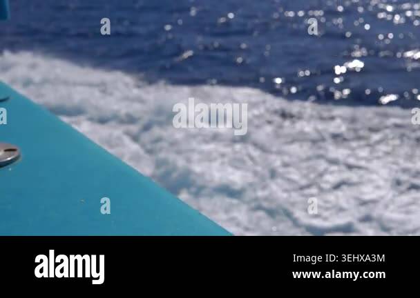 Dynamic sea waves from a boat motor create beautiful foamy traces ...