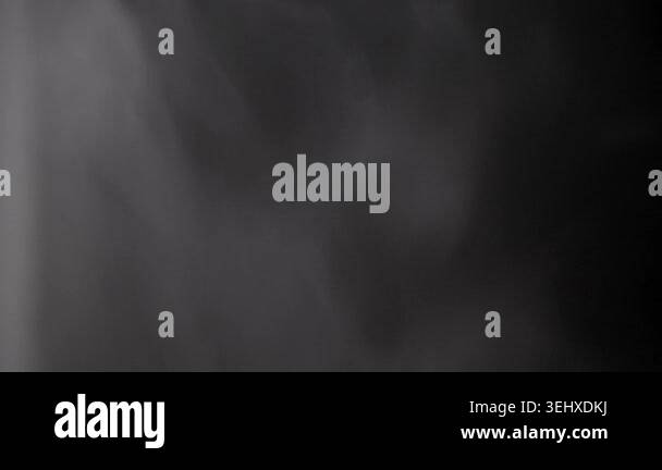 White smoke billows and swirls dynamically against a solid black ...