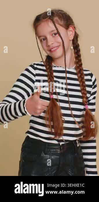 Like. Happy young preteen child girl kid looking approvingly at camera ...
